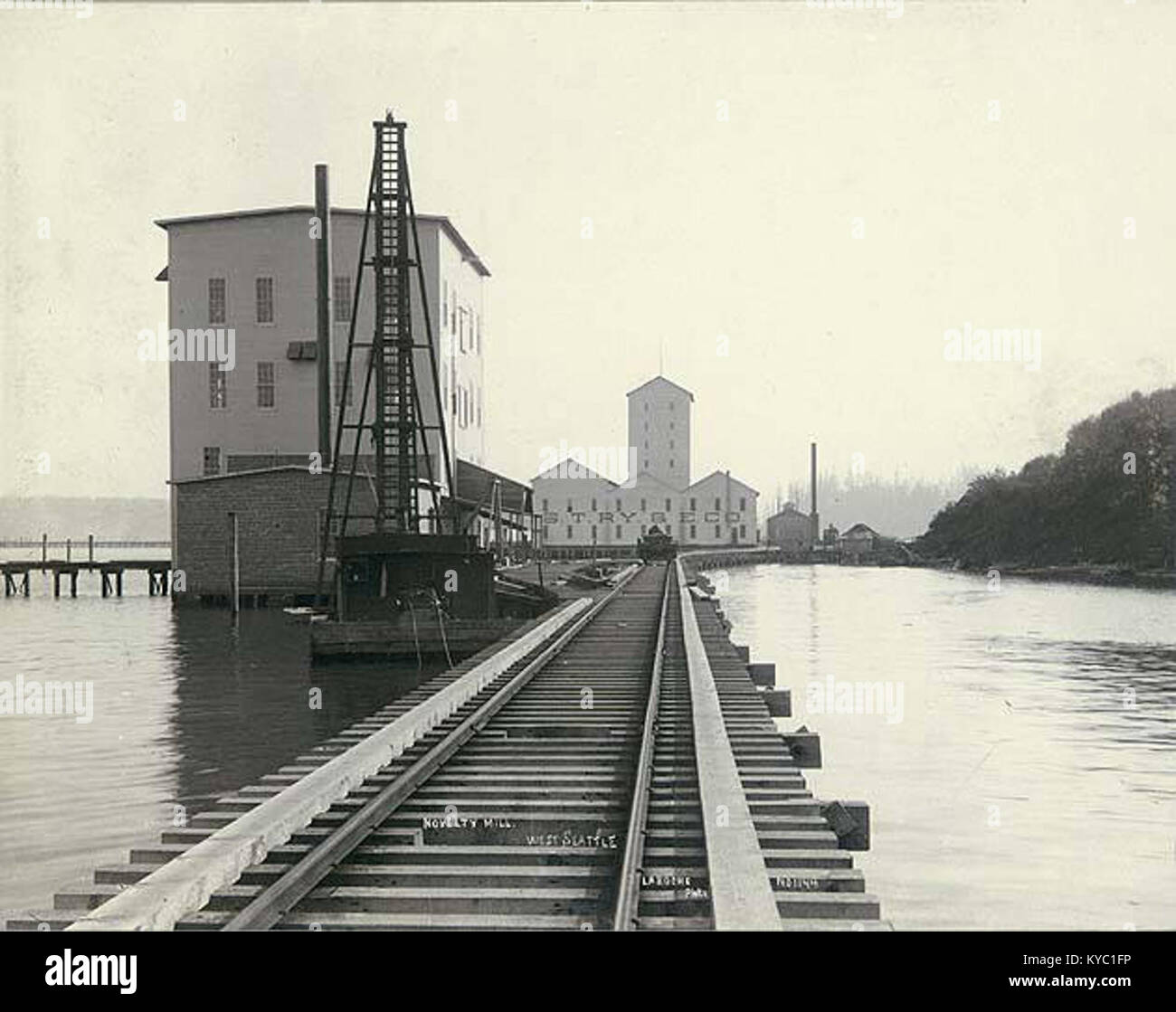 The photograph depicts the Novelty Mill Company, a historic industrial ...