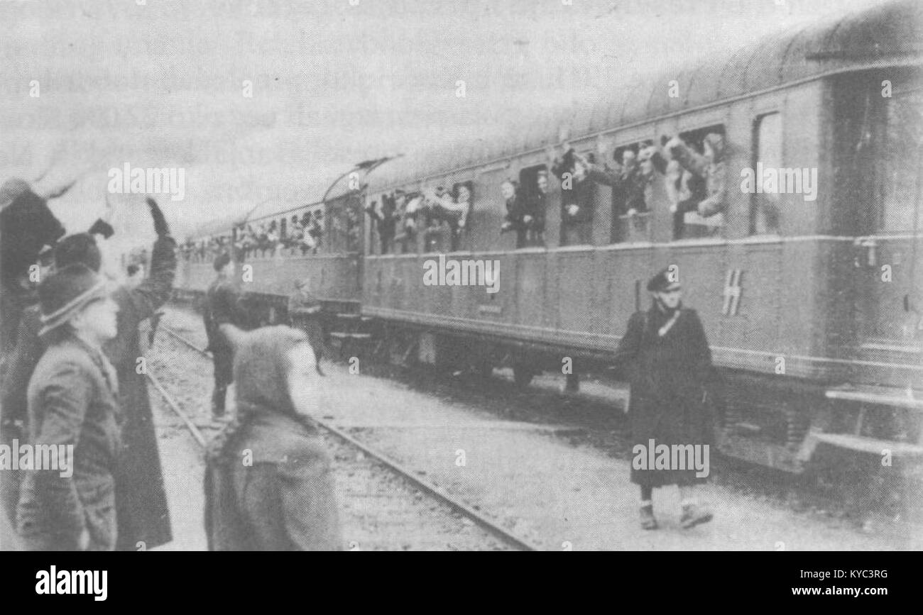 Historical photograph capturing the departure of a train carrying ...
