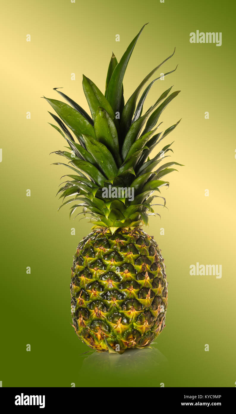 ripe organic pineapple close-up on a green background Stock Photo - Alamy