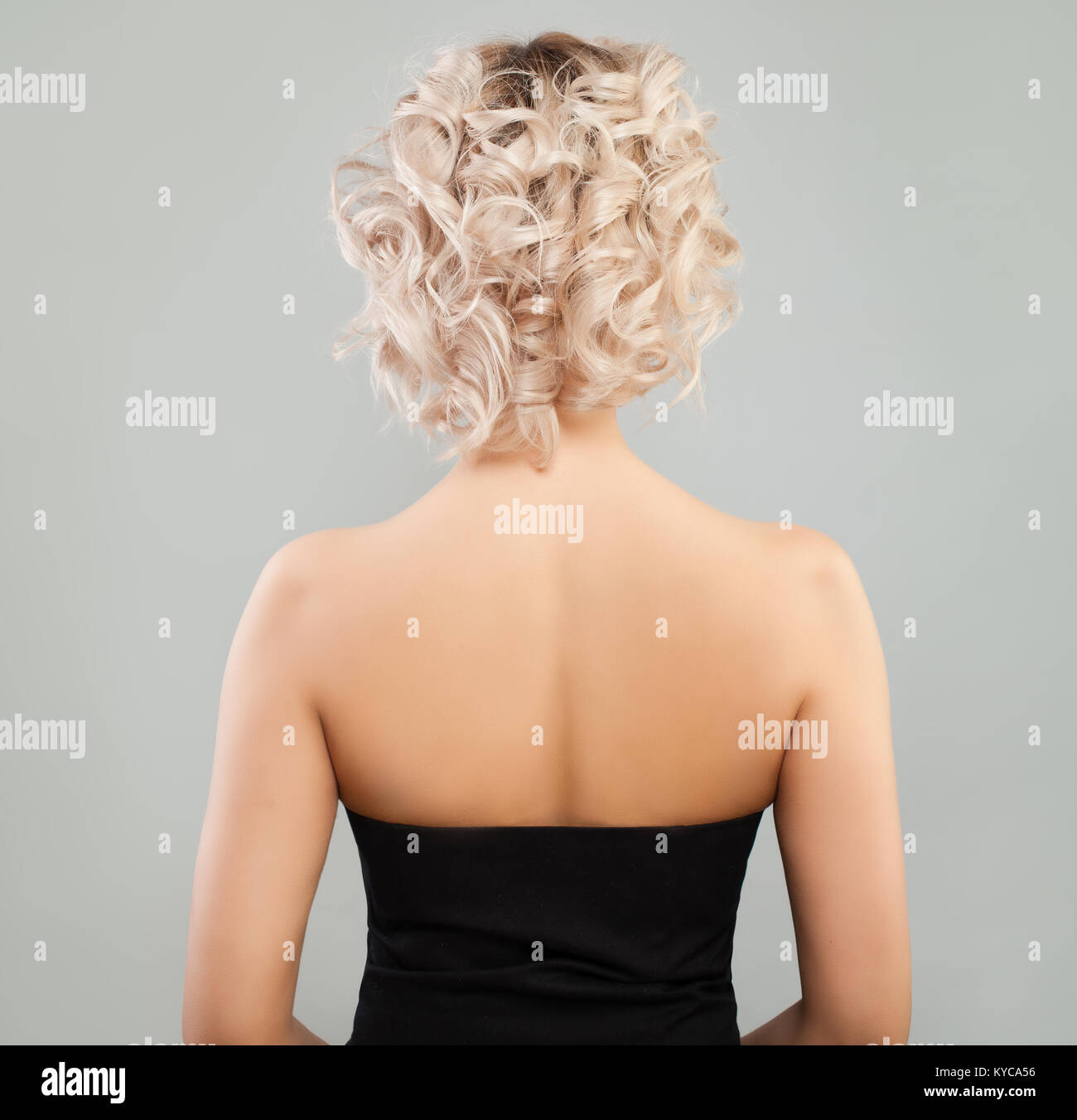 Blonde Woman with Curly Bob Hairstyle, Female Back Stock Photo - Alamy