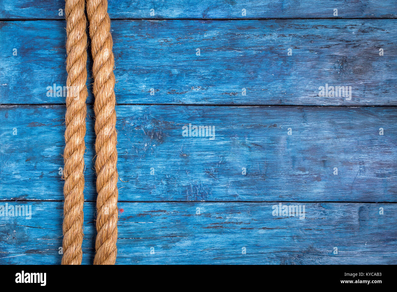 Rope on deep blue board Stock Photo - Alamy