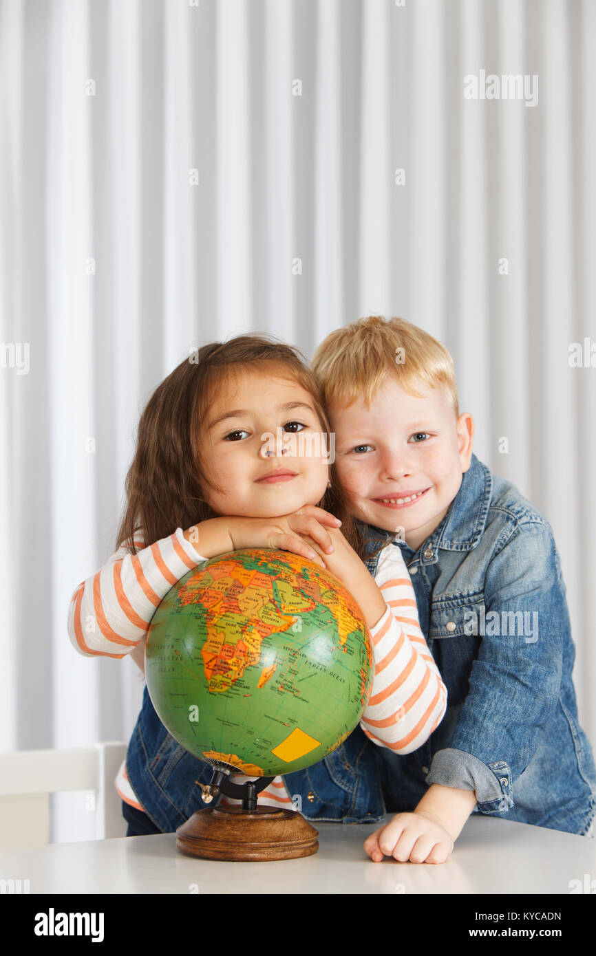 Kids on geography lesson Stock Photo - Alamy