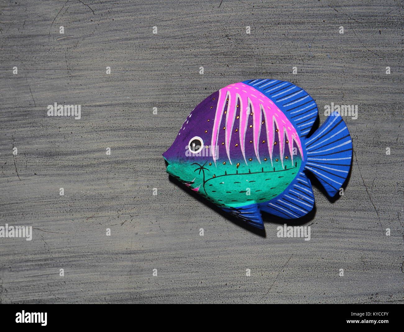 Colorful hand-painted ornamental fish on a grey background, image in ...