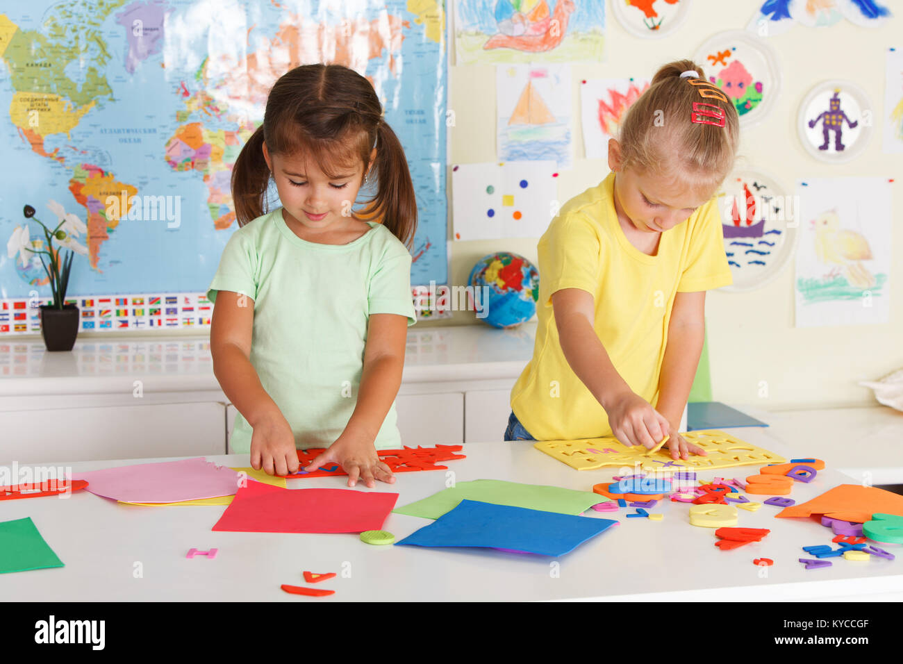 Two little girls in the classroom Stock Photo - Alamy