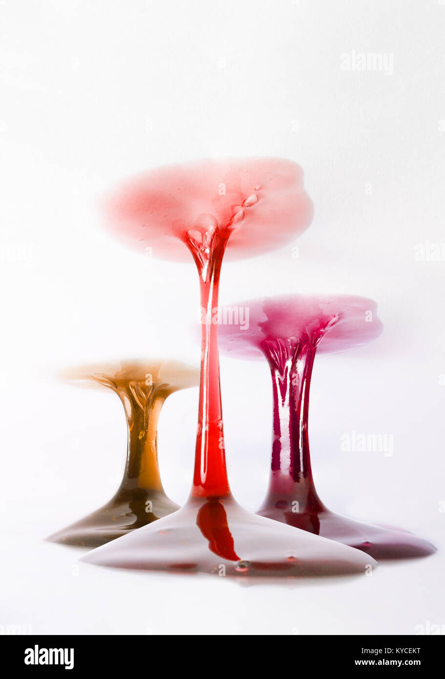 The viscous substance in the form of a colored gel is stretched between ...
