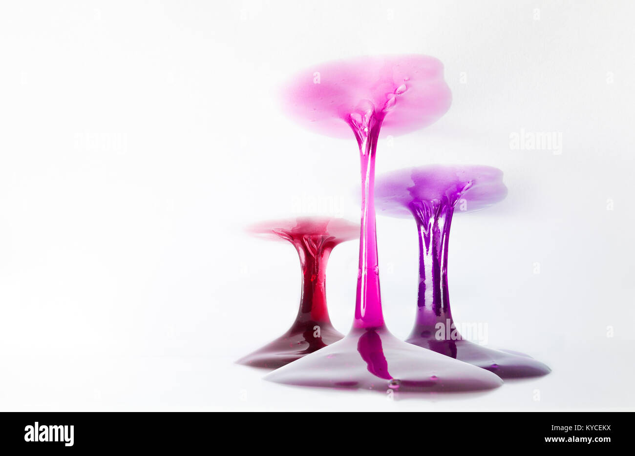 The viscous substance in the form of a colored gel is stretched between ...