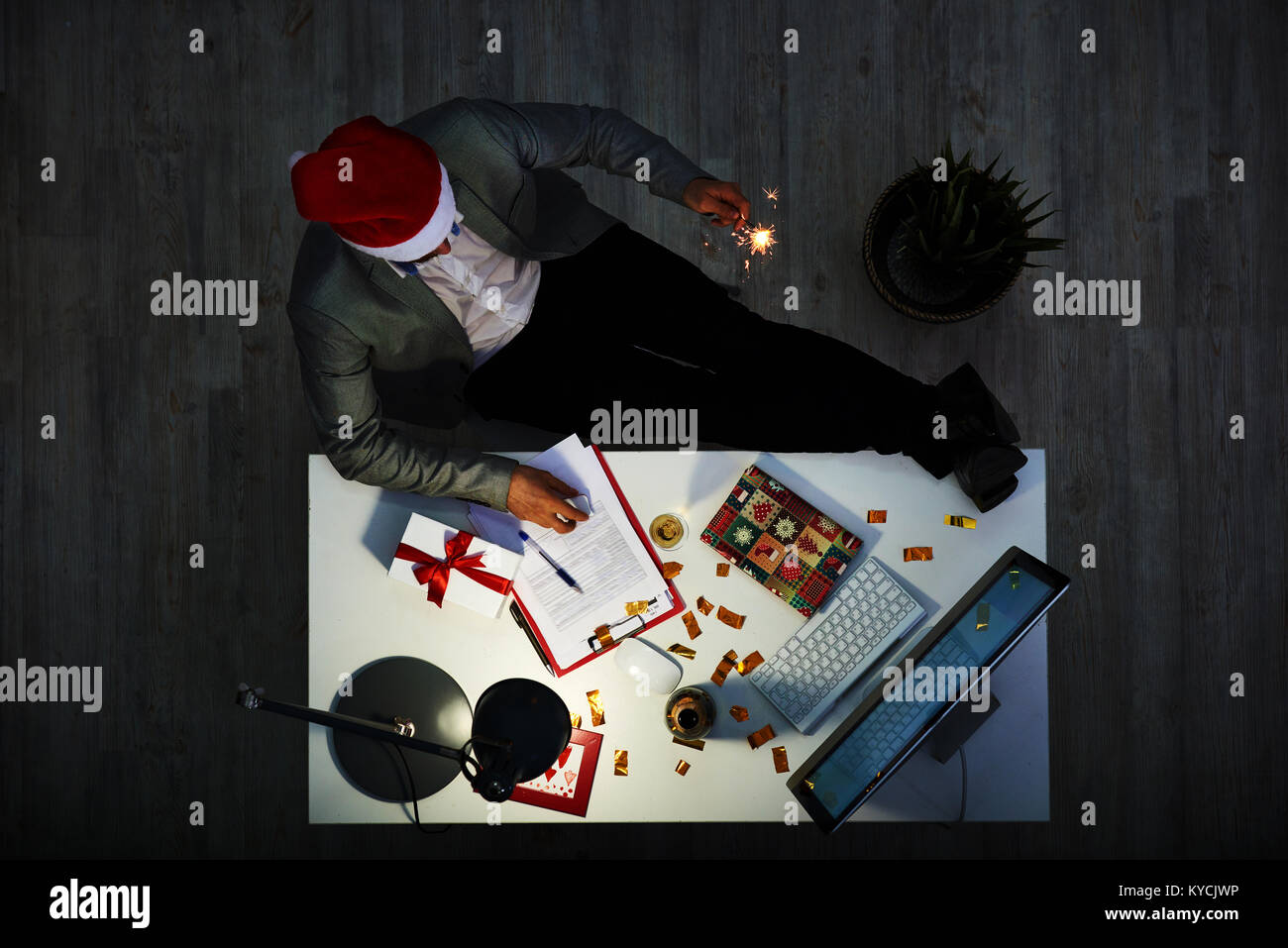 Celebrating Christmas Eve at work: unrecognizable white collar worker ...