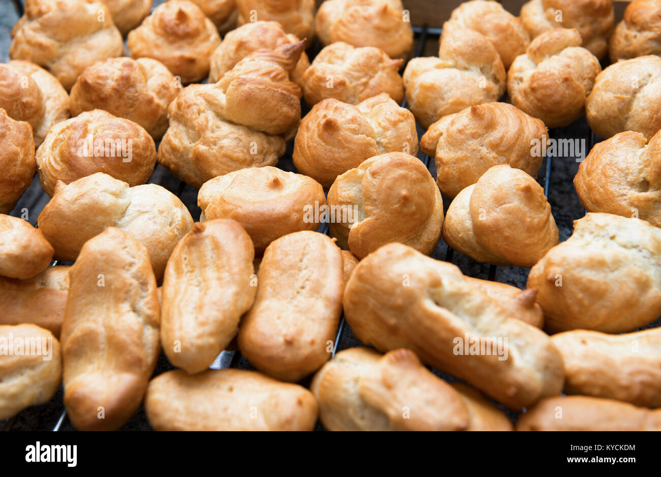 a preparation of the small cream puffs Stock Photo - Alamy