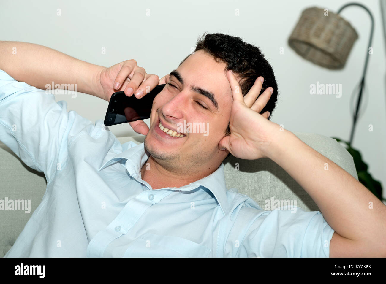 an happy young man calling on his mobile phone Stock Photo - Alamy