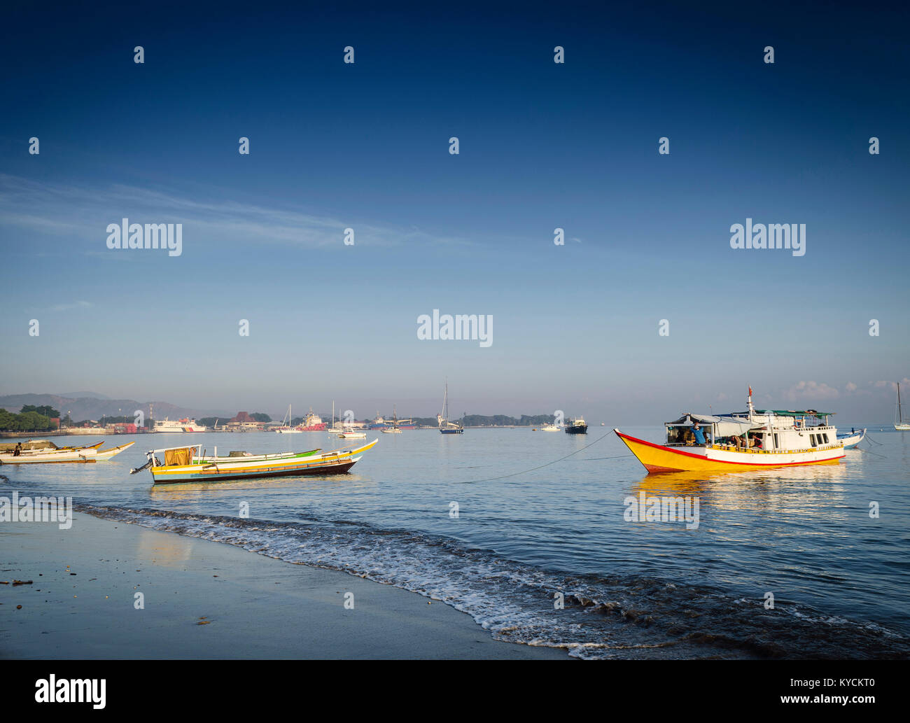 coast with traditional fishing boats on dili beach in east timor leste ...