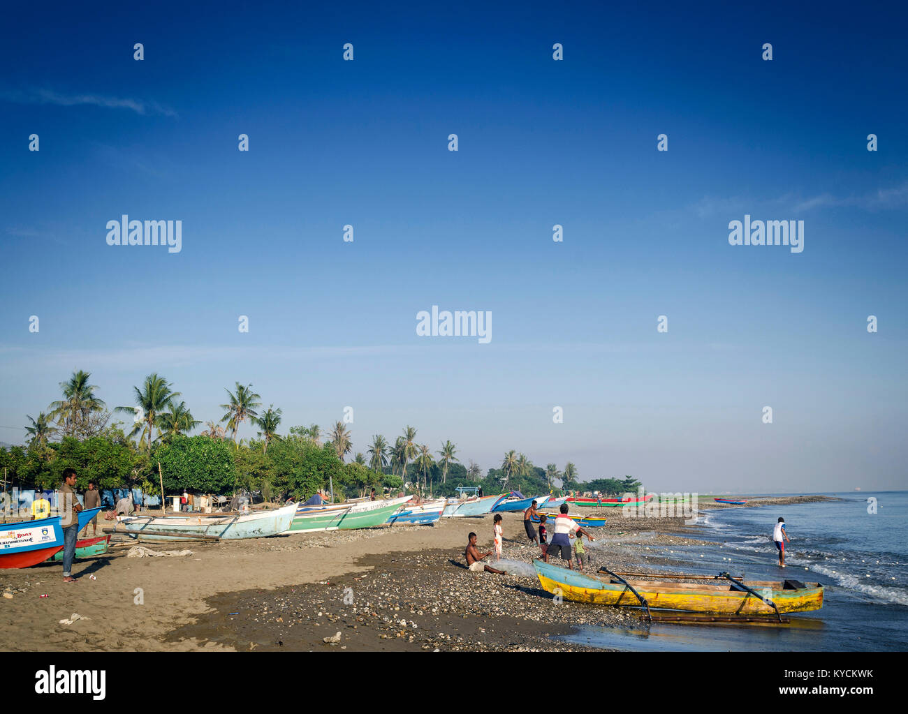 coast with traditional fishing boats on dili beach in east timor leste ...
