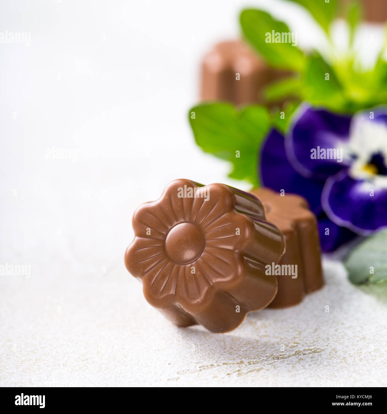 Chocolate candies in flower shape Stock Photo - Alamy