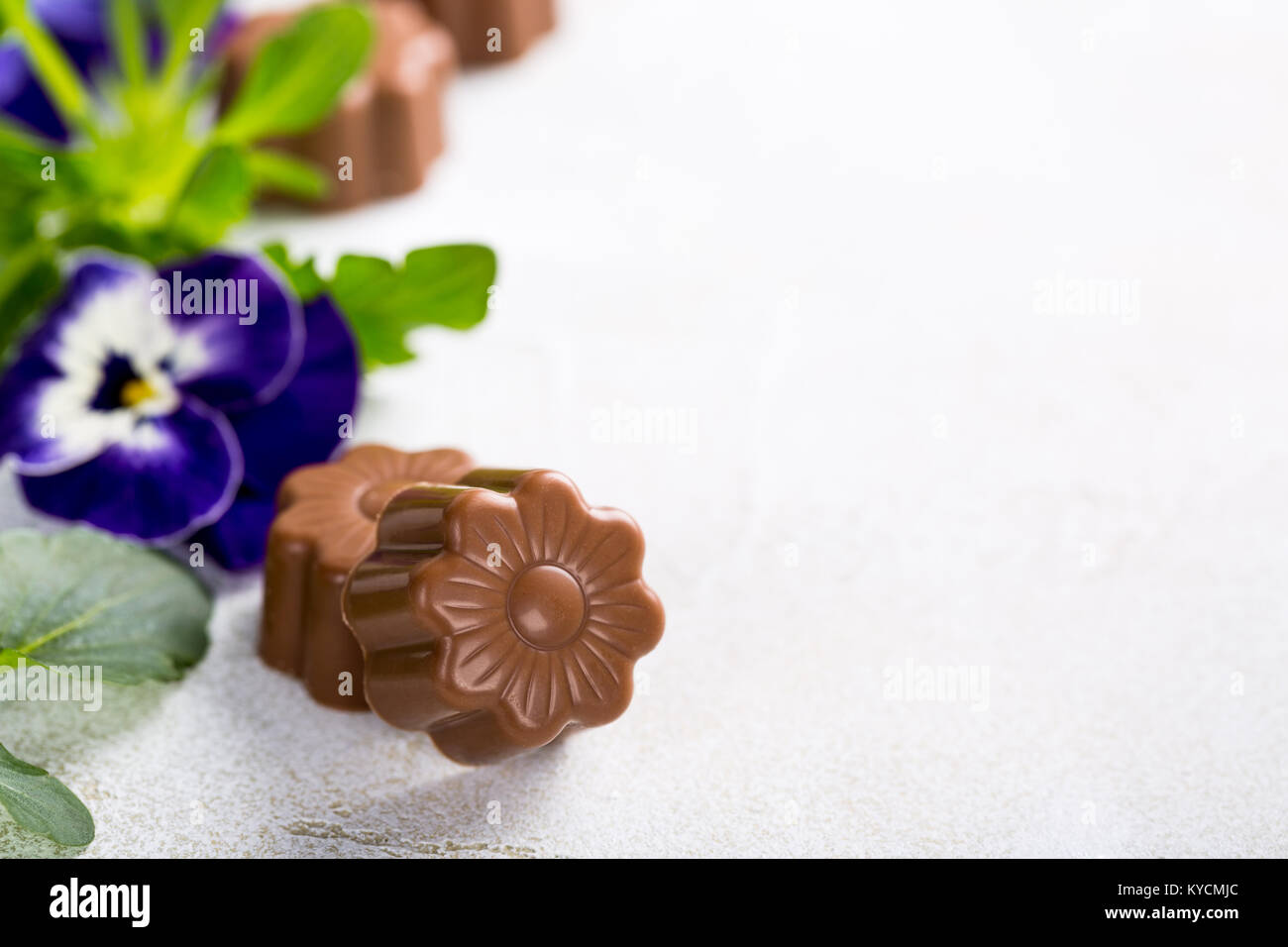 Chocolate candies in flower shape Stock Photo - Alamy