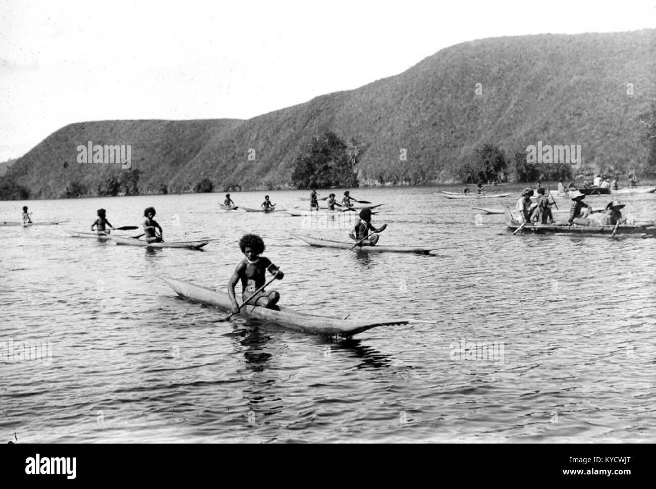 Photograph showing Papuan people in canoes on Lake Sentani, New Guinea ...