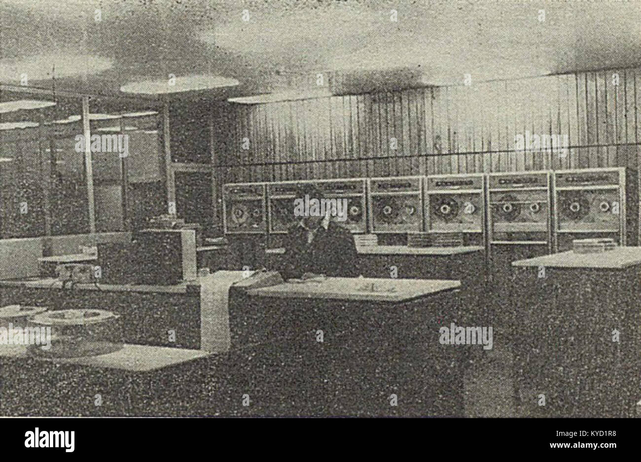 A historical photograph of a computer room (sala komputerowa) from ...