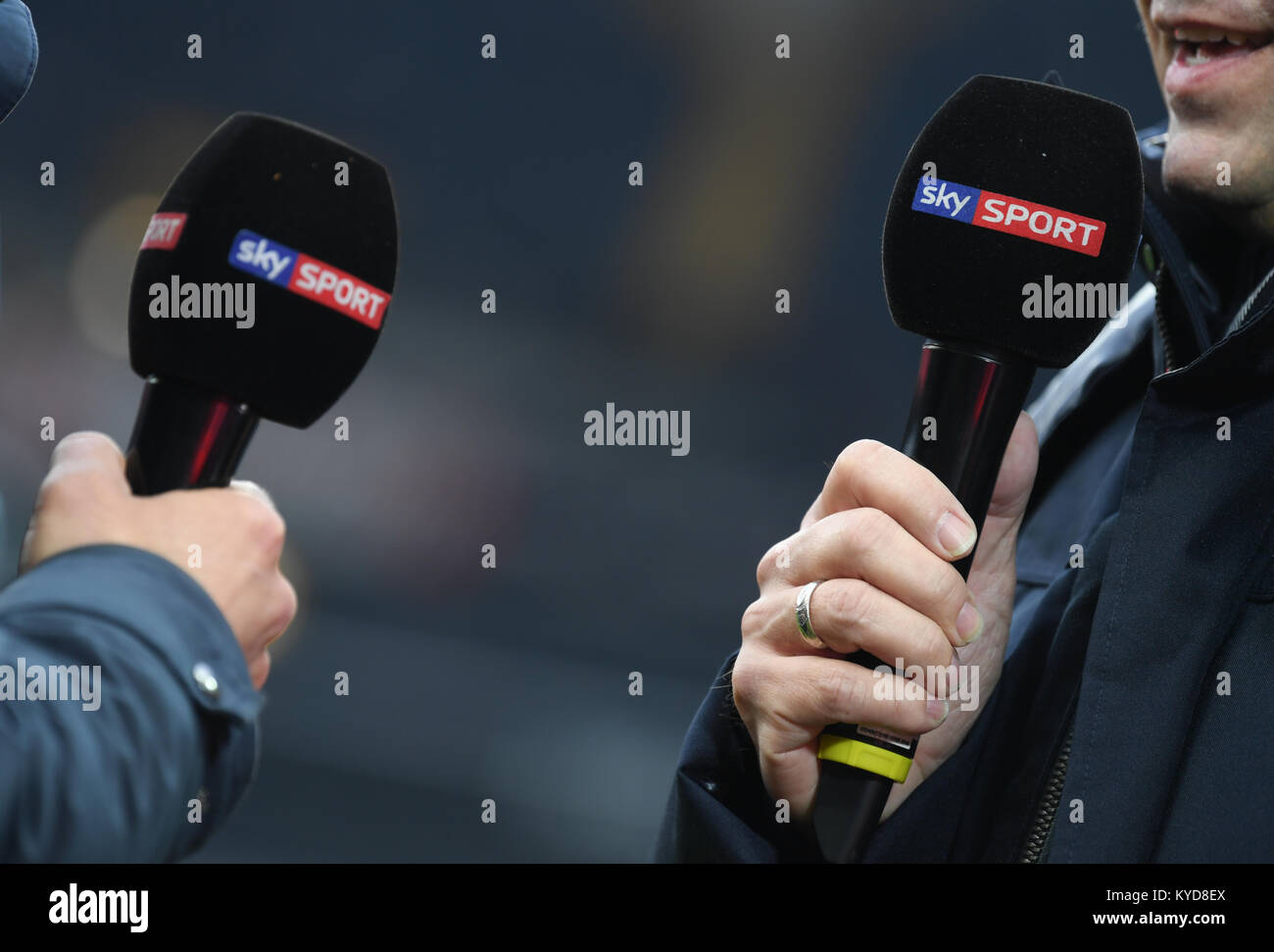 Sky moderator (R) and Trainer Niko Kovac hold sky microphones during an ...