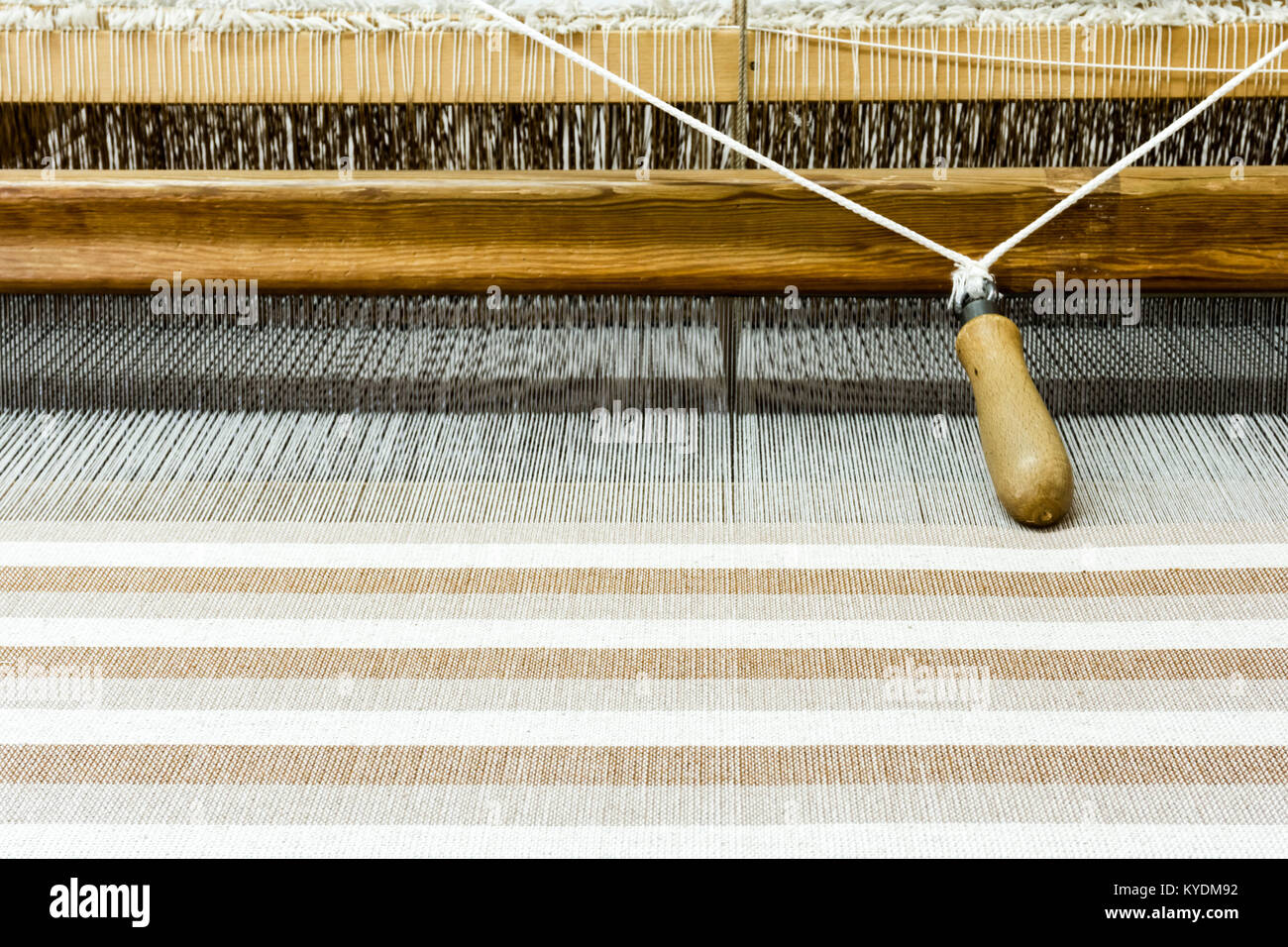 close up view of cloth and loom Stock Photo - Alamy