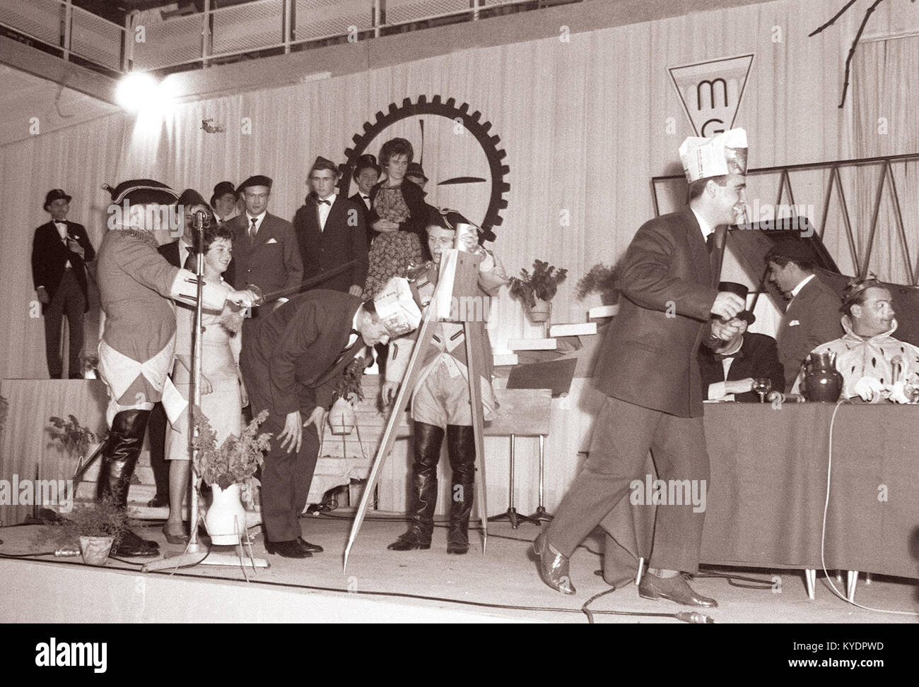 A historical photograph showing a group of students in 1960 completing ...