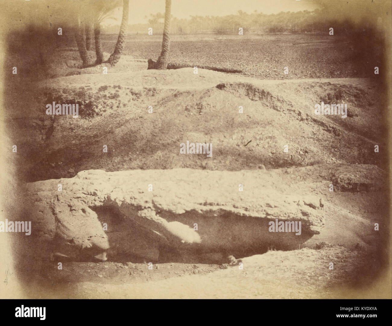 This image depicts a close-up of a sculpture from an excavation site ...