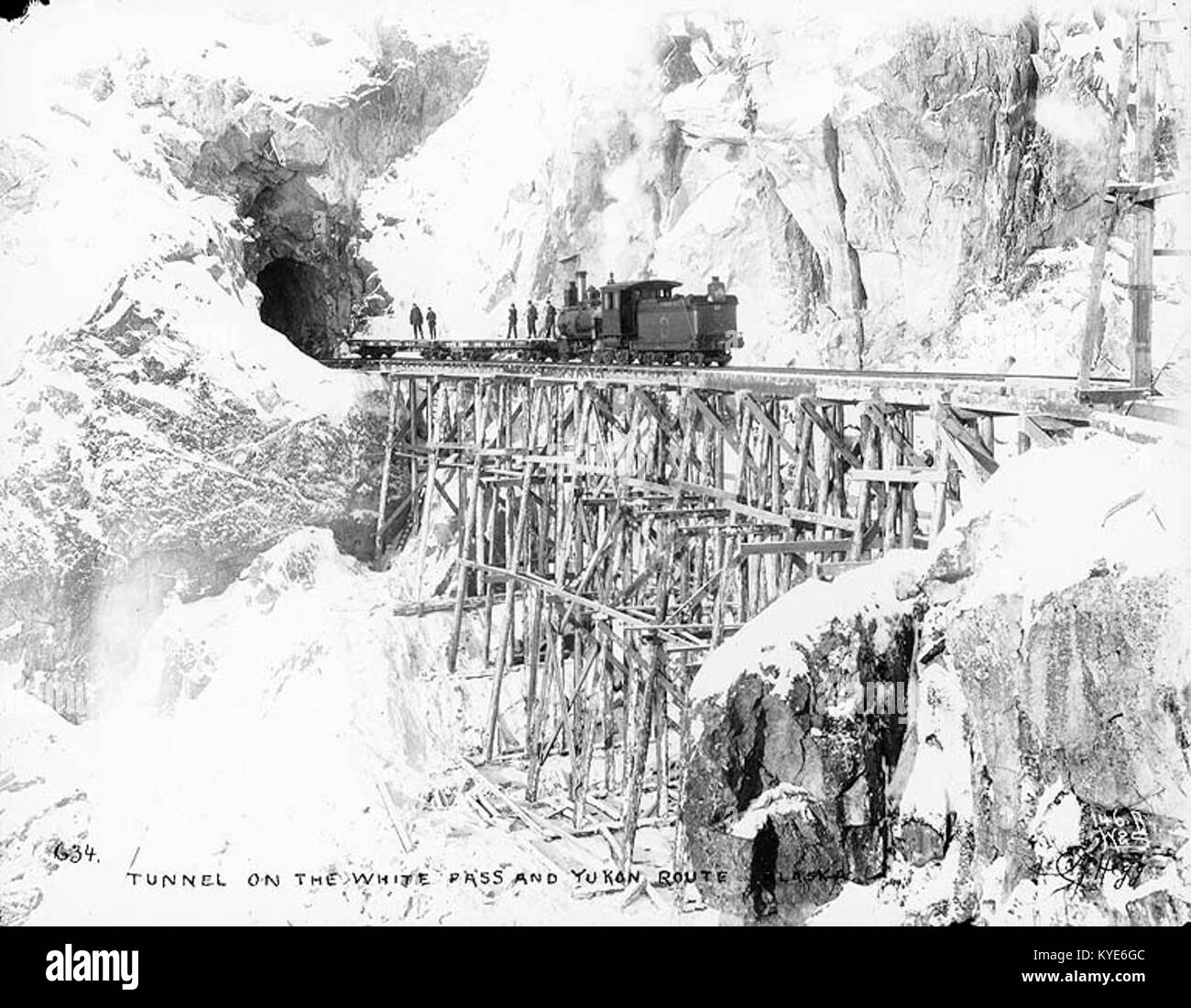 Train of the White Pass & Yukon Railroad on a trestle bridge leading to ...