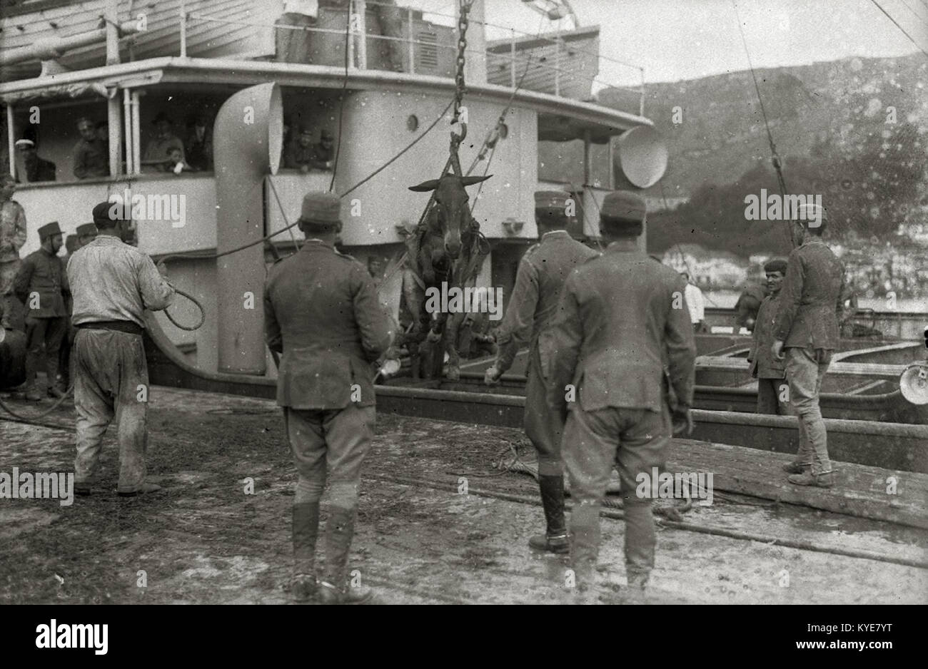 This photograph shows troops boarding ships at the port of Pasaia ...
