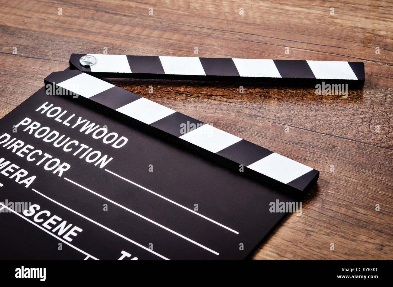 Vintage photo of movie clapper on wood background Stock Photo - Alamy