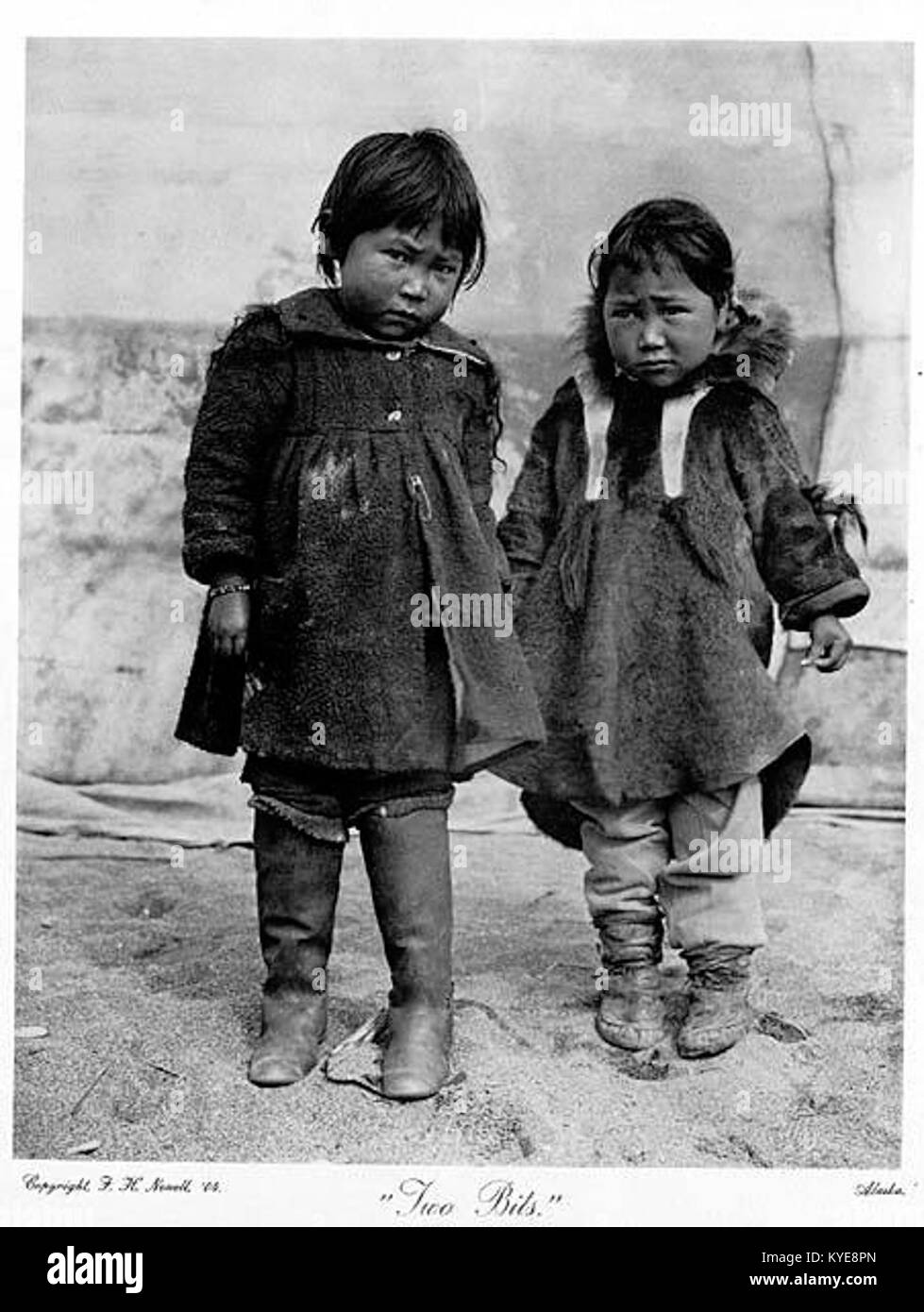 A 1904 photograph showing two Inuit (Eskimo) children dressed in ...