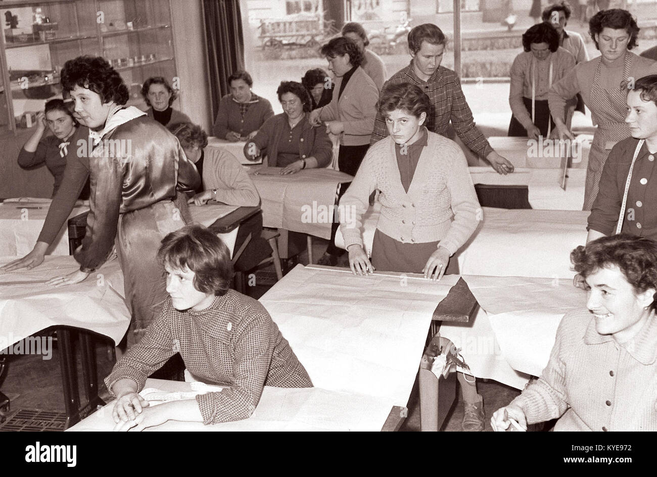 Photograph showing students participating in Singer sewing course in ...
