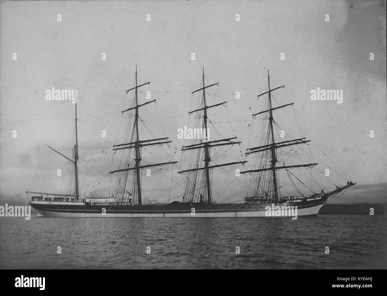 The image shows a four-masted bark anchored off the coast of Washington ...