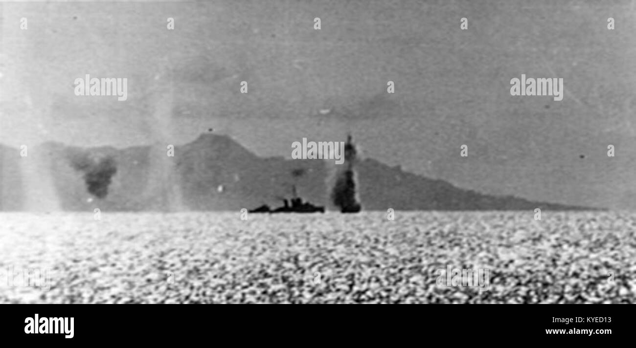 The USS Mugford (DD-389), a U.S. Navy destroyer, is shown under air ...