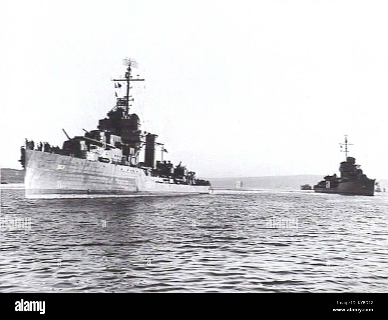 Photograph showing USS Reid (DD-369) and USS Mugford (DD-389) docked in ...
