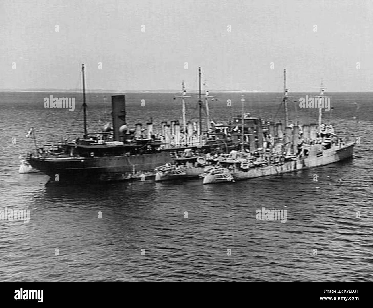 USS Victoria (AO-46) fueling Clemson-class destroyers in 1942 Stock ...