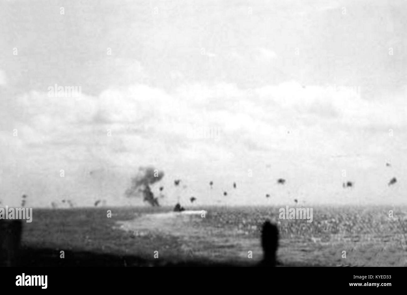 The image captures the USS Walke (DD-416) under attack during the ...