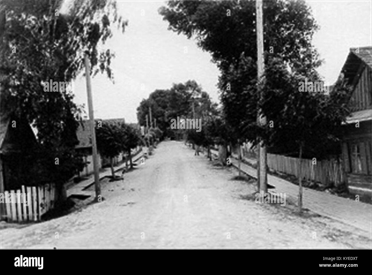 This image features Uzda, a town in Belarus, showing a typical street ...