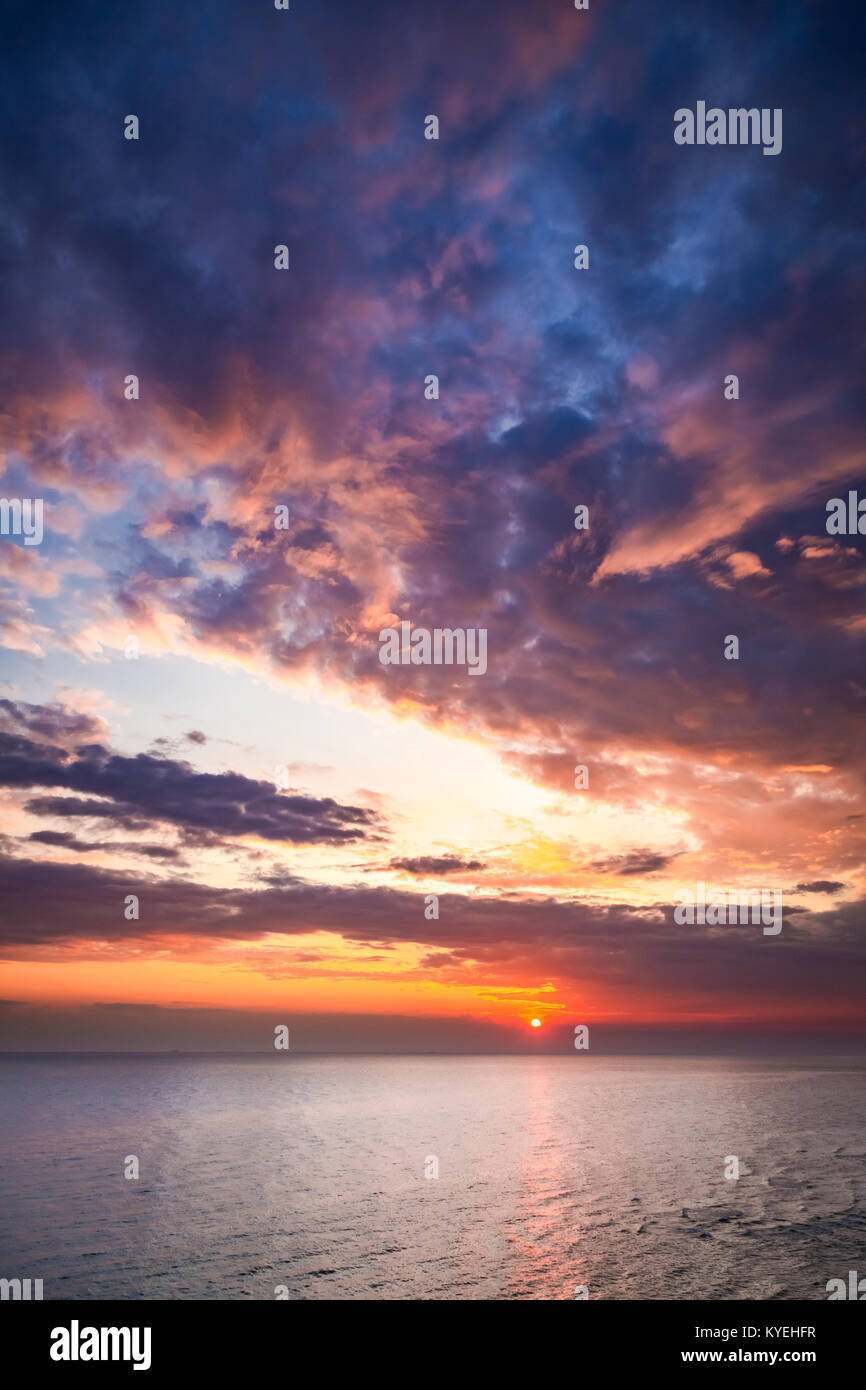 Sunset over calm sea in summer with sun beam, Europe Stock Photo - Alamy