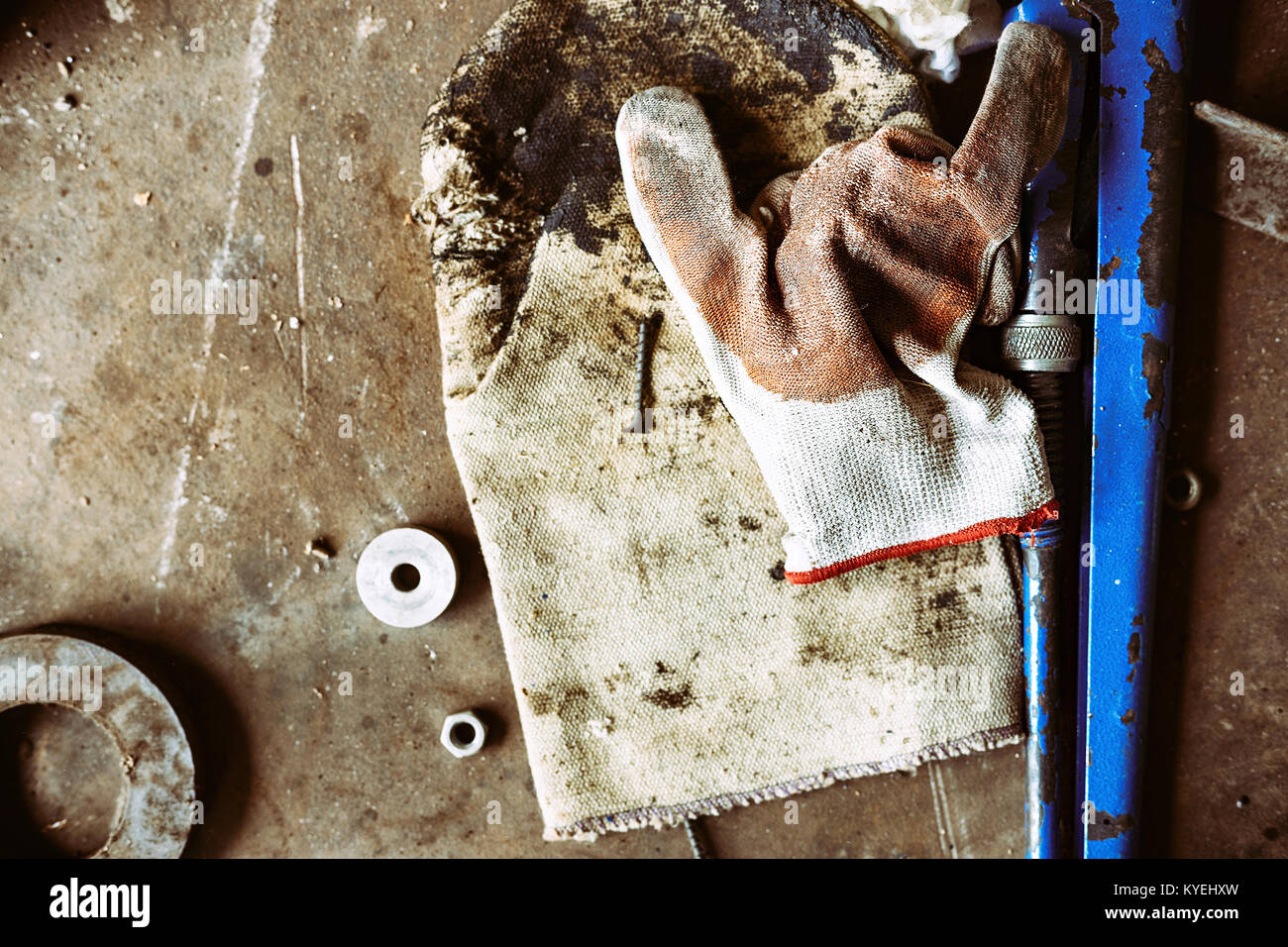 uncleared workshop with tools. on the dirty stone floor scattered tools ...