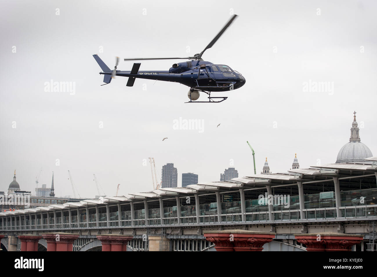 A helicopter flying low over the temporarily closed Blackfriars Bridge ...