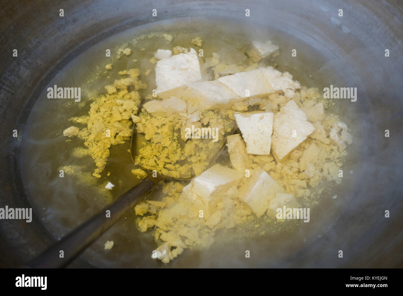 Cheese traditional preparation in boiled water Stock Photo - Alamy