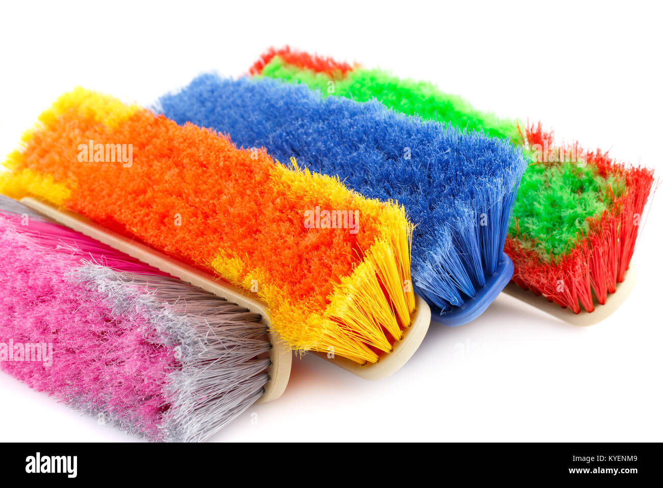 Colorful brooms isolated on white background Stock Photo - Alamy