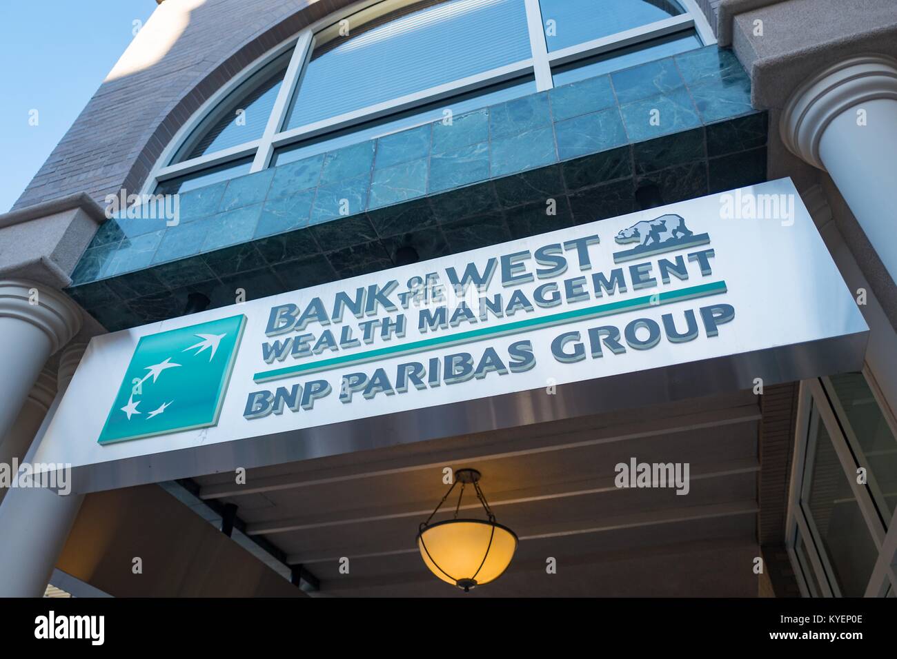 Sign with logo for Wealth Management branch of Bank of the West, a ...
