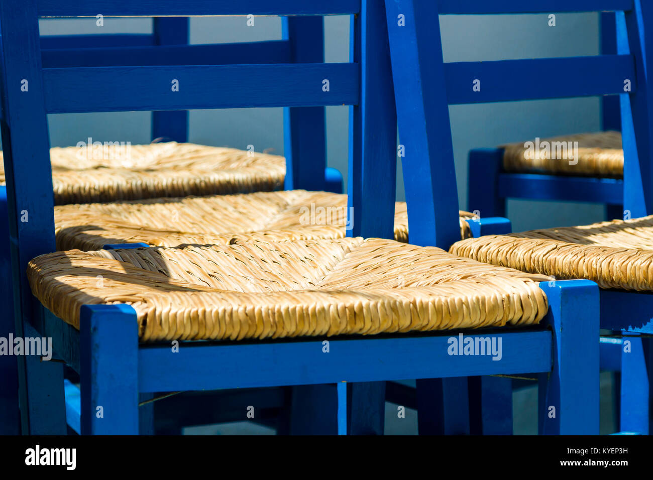 Traditional painted blue chairs on an empty Greek terrace Stock Photo ...