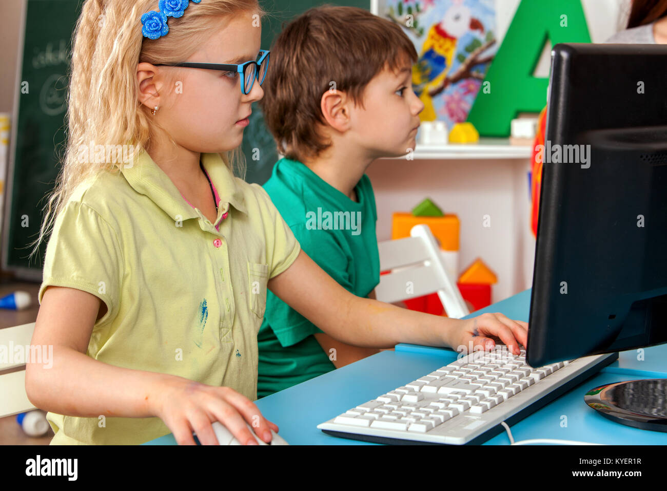 Children computer class us for education and video game Stock Photo - Alamy