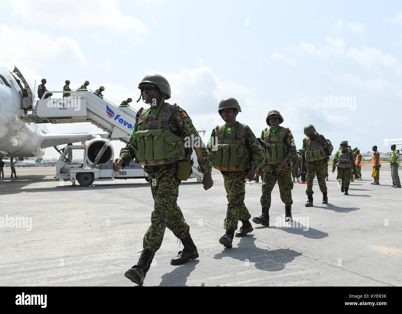 Newly deployed peacekeeping troops walk through Aden Abdulle ...