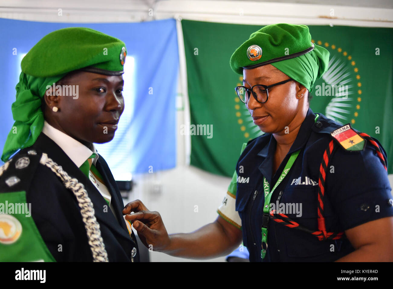 A Ugandan police officer receives an award during a medal ceremony at ...