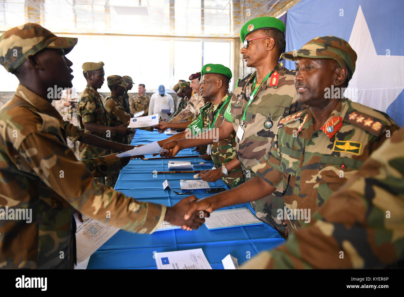 Photograph of senior officers from the Somali National Army (SNA), AMISOM, and EUTM handing over ...