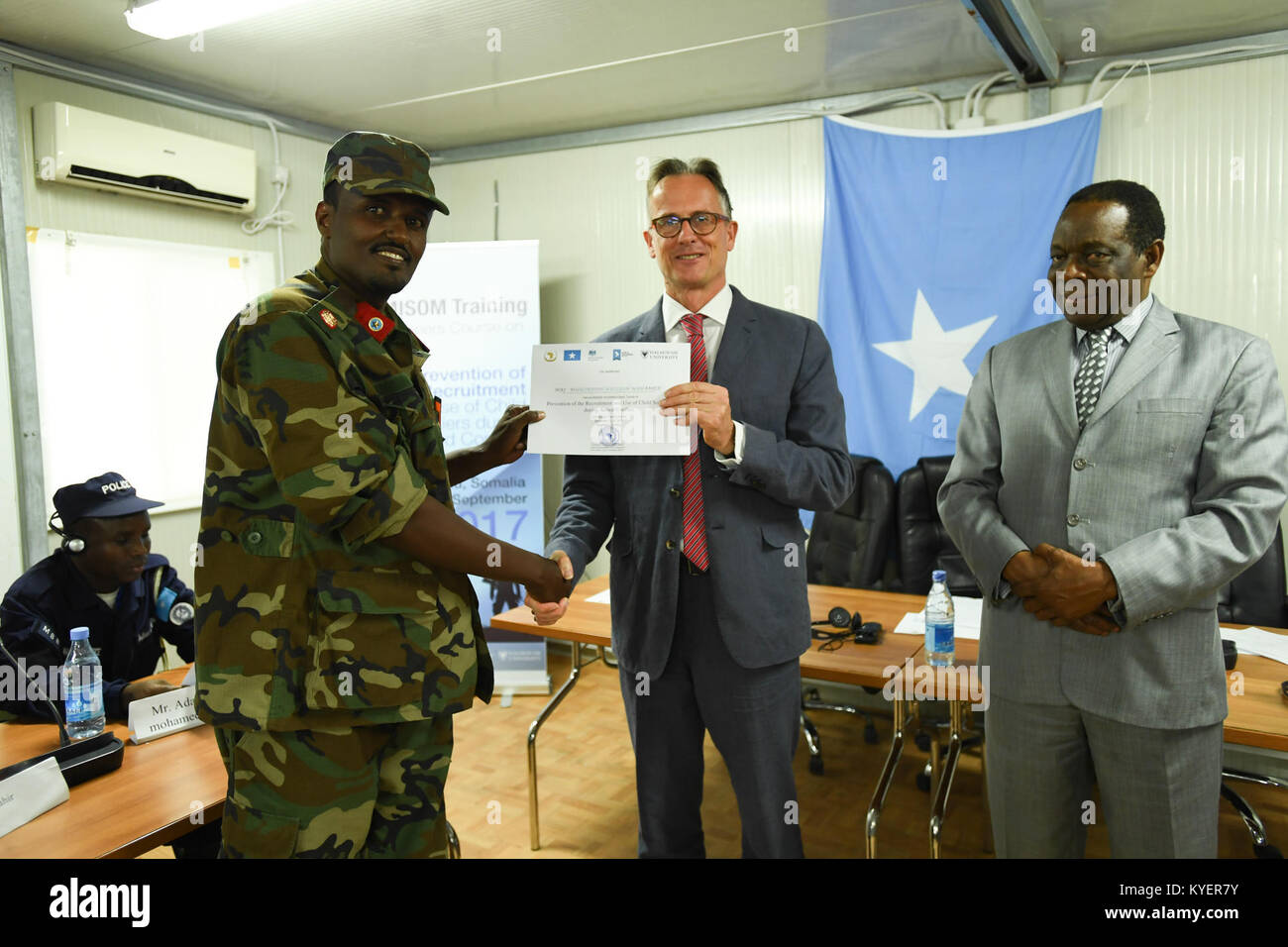 A photograph of David Concar, British Ambassador to Somalia, presenting ...