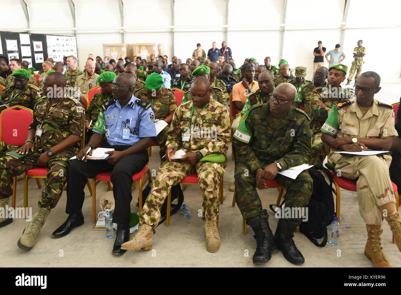Officers from the African Union Mission in Somalia (AMISOM) attend the ...