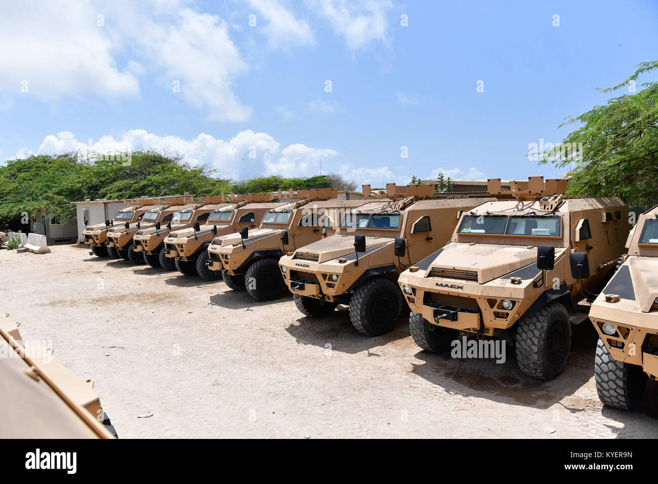 A photograph showing vehicles donated to the AMISOM Ugandan Contingent ...