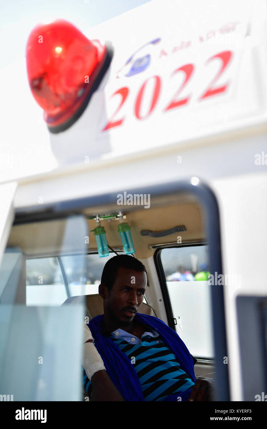 A victim of the October 14, 2017 Mogadishu blast sits in an ambulance ...