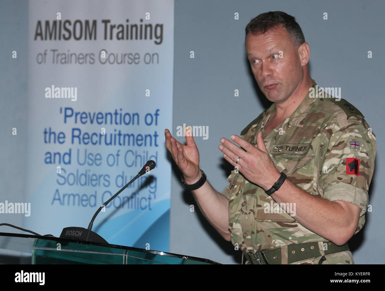 Photograph of Lt. Col. Ewen Turner addressing participants during the ...